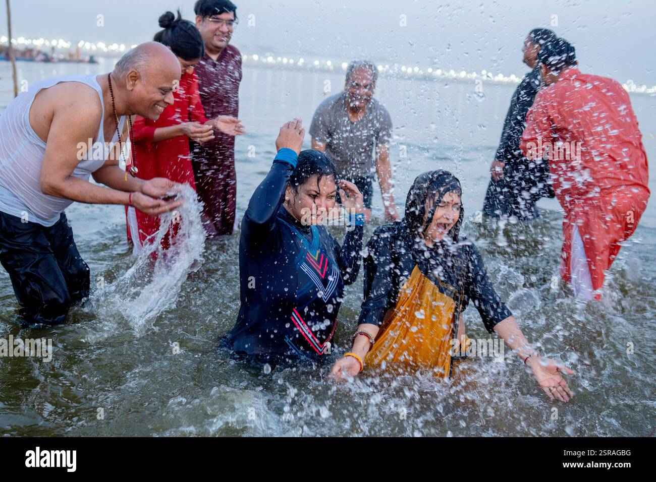 Hindu devotees take a holy dip at the Sangam, the confluence of three ...