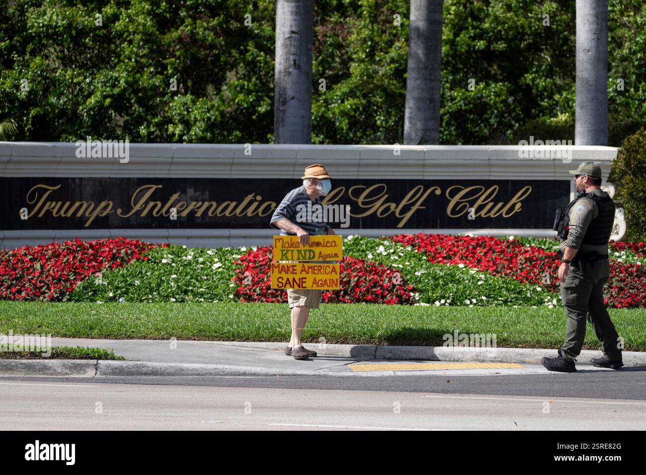 An officer from the Sheriff's Department advises demonstrator and ...