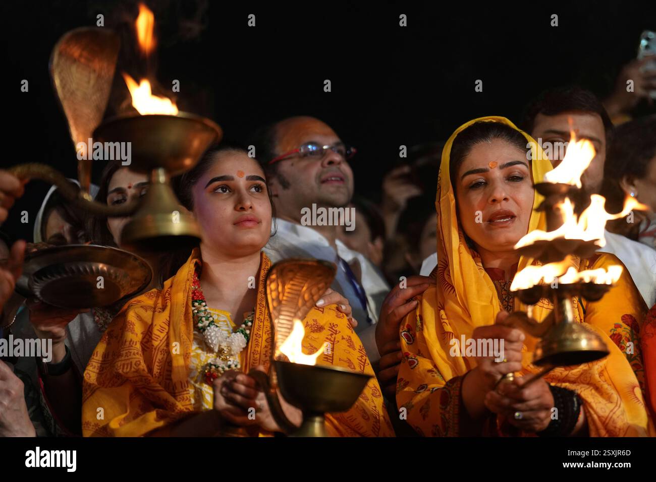 Bollywood actor Raveena Tandon and her daughter rotate traditional oil ...