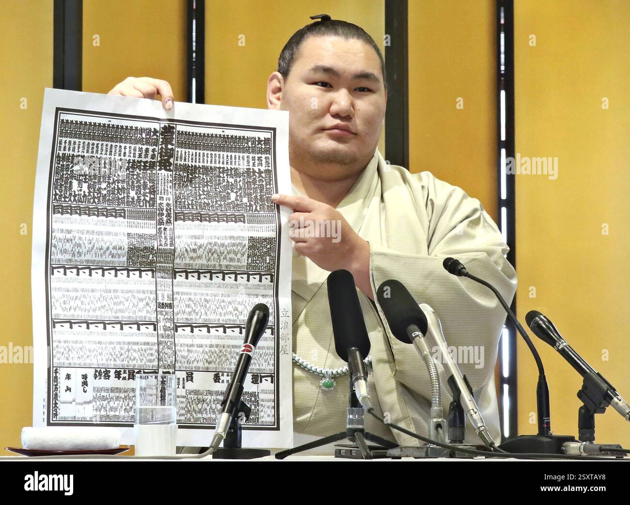 Mongolian Yokozuna Hoshoryu Tomokatsu points out his name on the ...