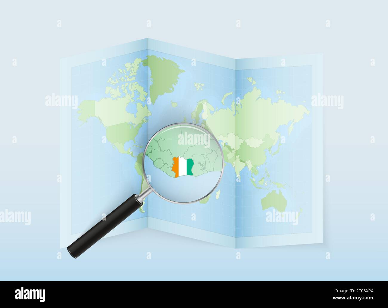 Une carte du monde pliée avec une loupe pointant vers la Côte d'Ivoire ...