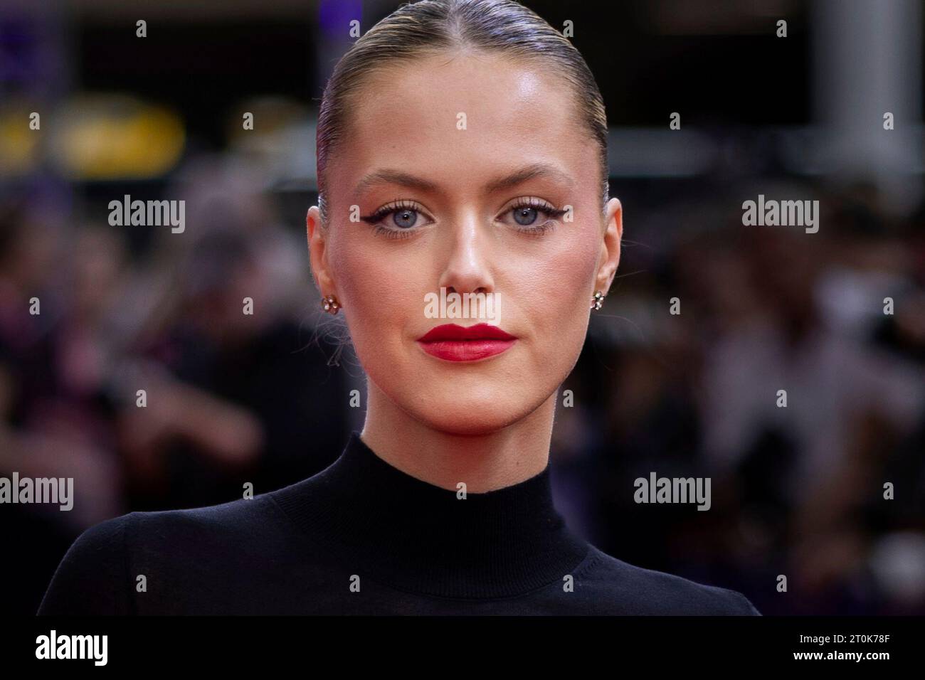 Madie PLT poses for photographers upon arrival for the premiere of the film 'Killers of the ...