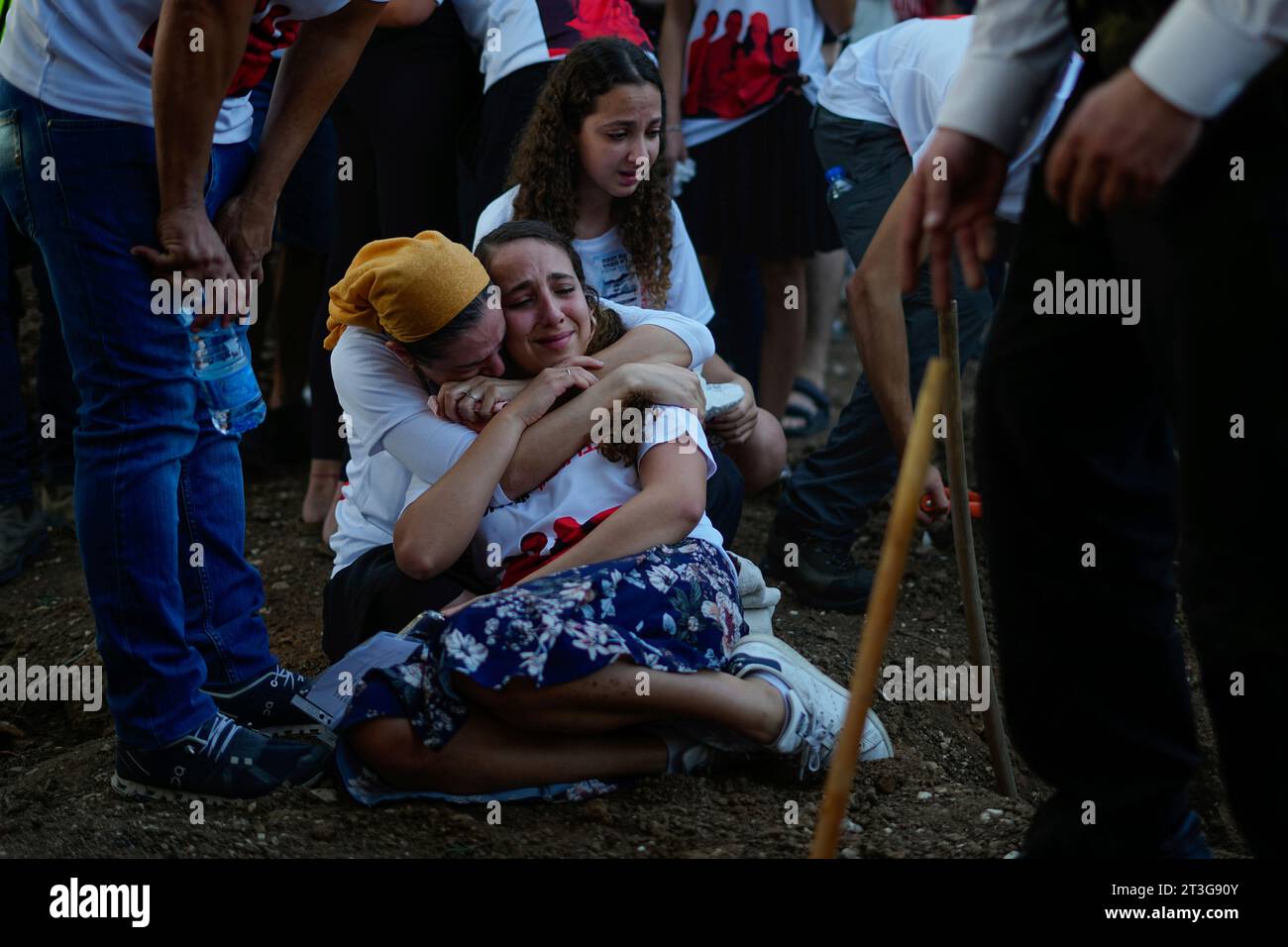 Mourners gather around the graves of British-Israelis Lianne Sharabi ...