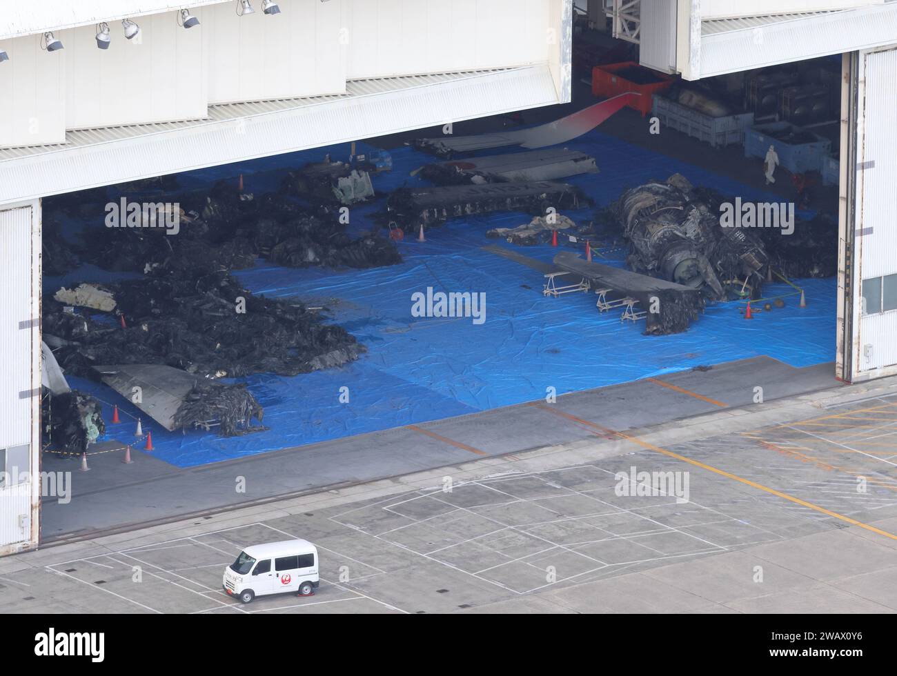 Debris of the Japan Airlines Flight 516, which was burnt after it ...