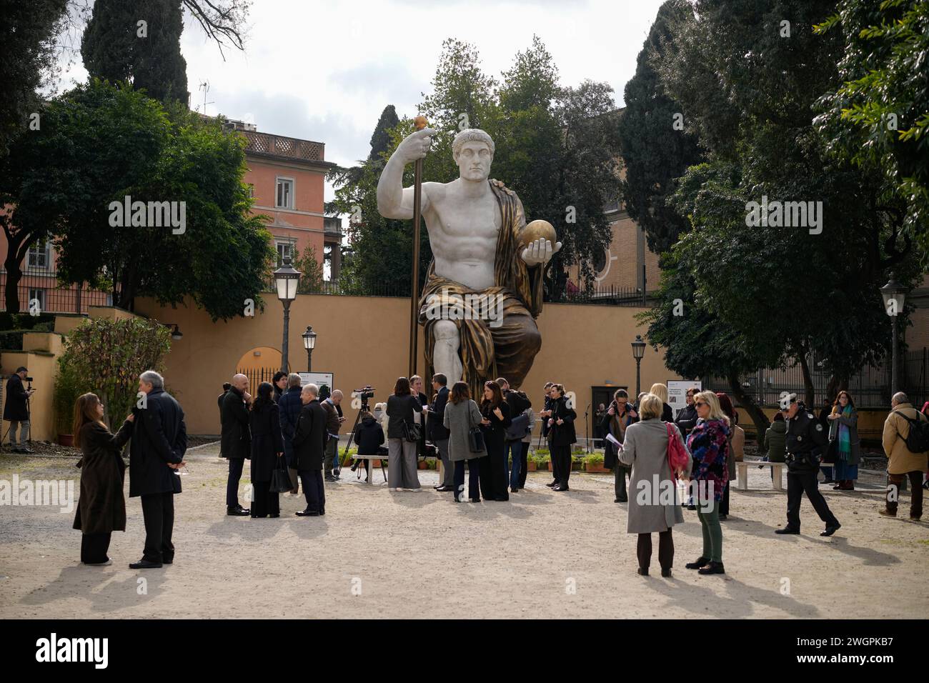 Visitors admire a massive, 13-meter (yard) replica of the statue Roman ...