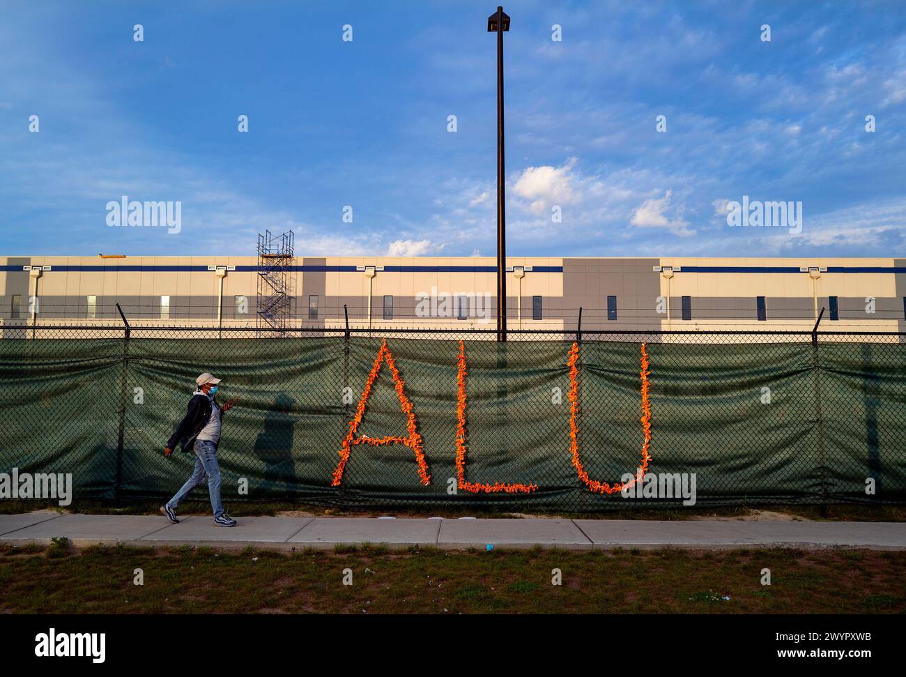 FILE - Letters representing Amazon Labor Union adorn a fence adjacent ...