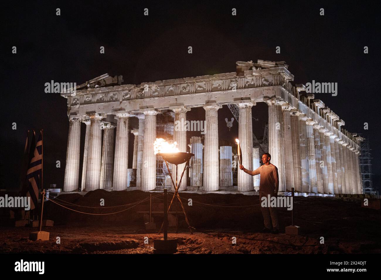 Retired Greek 400-meter hurdles champion Periklis Iakovakis holds a ...