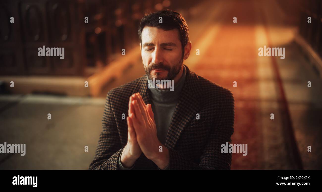 Homme à genoux priant Banque de photographies et d’images à haute ...