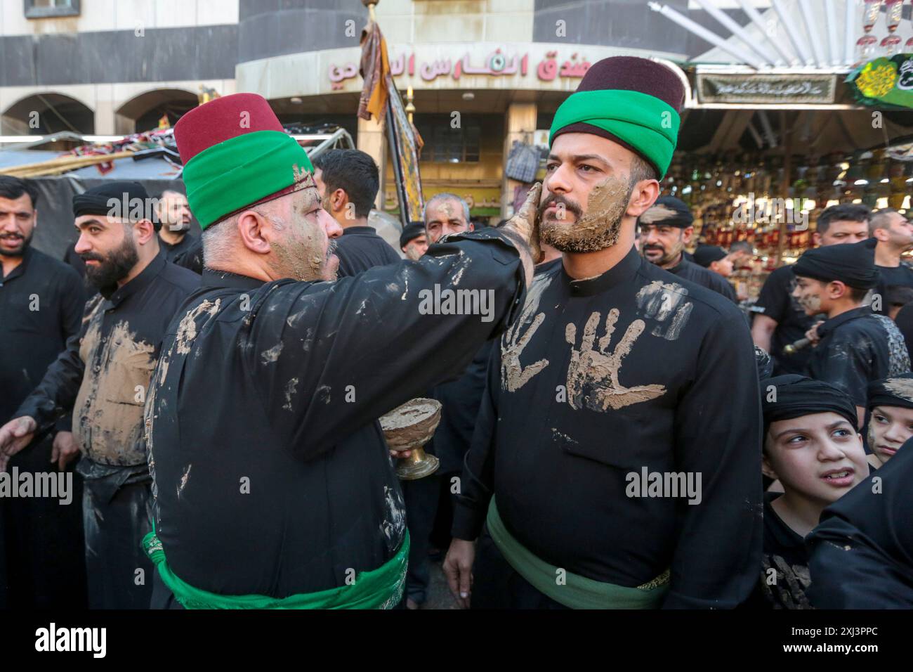 Iraqi Shiites mark the month of Muharram in Karbala, Iraq, on Tuesday ...