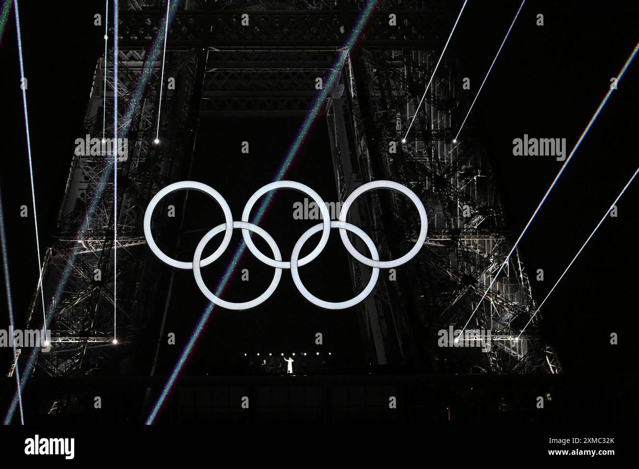 Canadian singer Celine Dion performs on the Eiffel Tower on the screen ...
