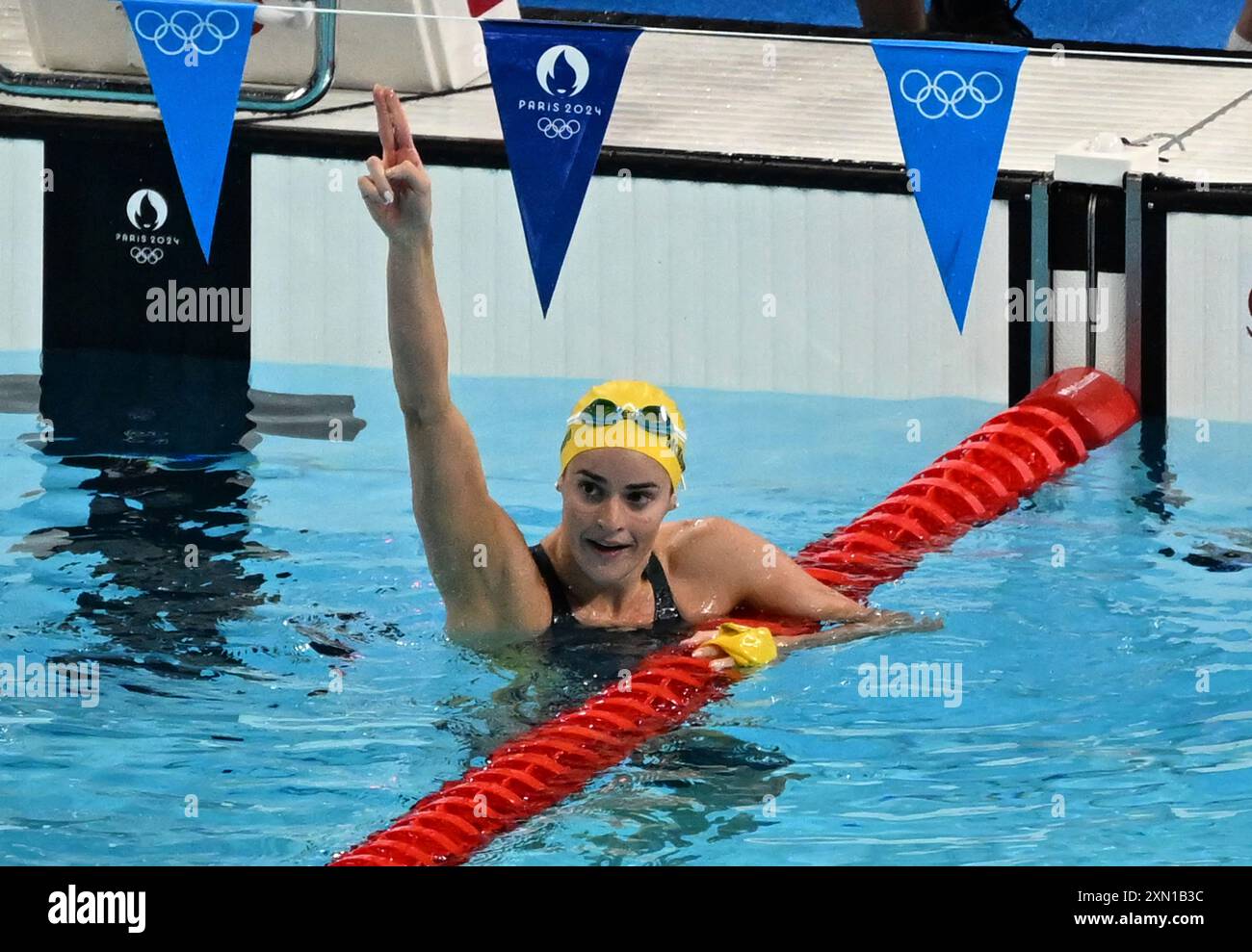 Australia's McKEOWN Kaylee reacts after winning the women's swimming 100m backstroke final in ...
