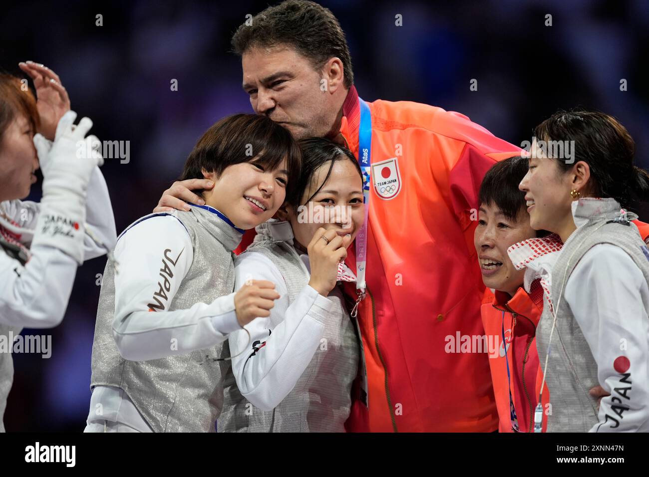 Japan's fencers Sera Azuma, Yuka Ueno, Karin Miyawaki, Komaki Kikuchi celebrate after winning ...