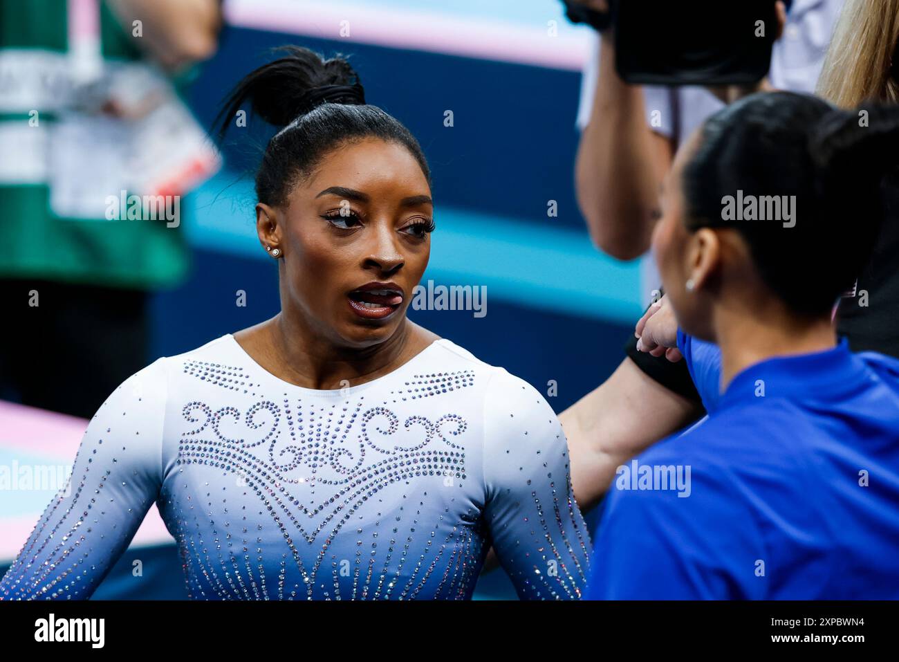 Simone Biles of United States with a serious gesture after falling ...