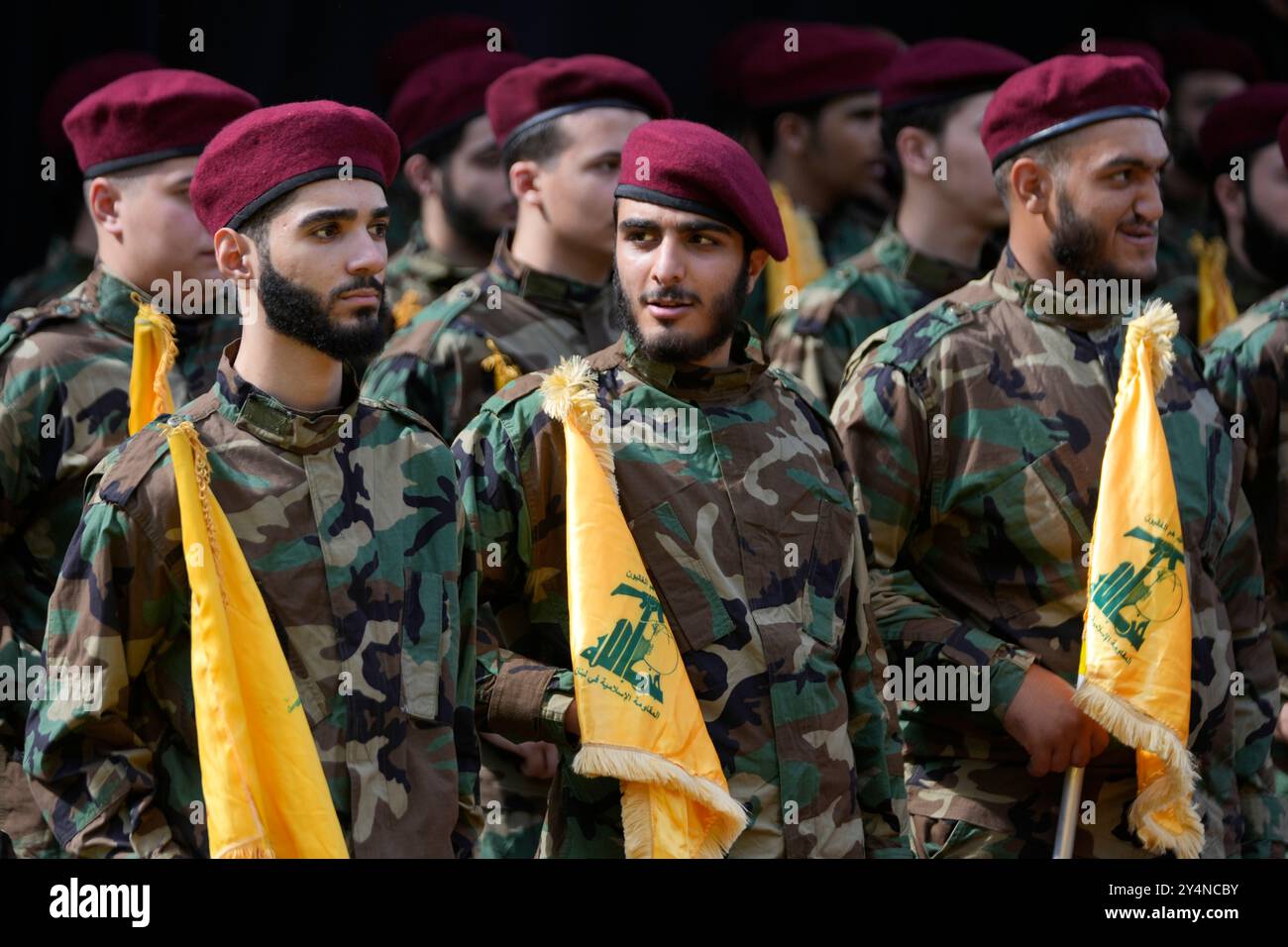 Hezbollah members attend the funeral of two of their comrades who were ...