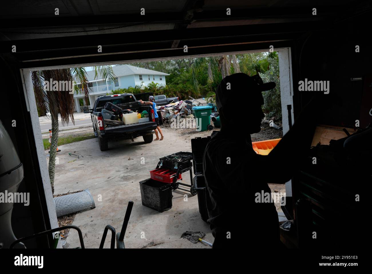 Mechanic Evan Purcell, 43, right, and friend Ted Carlson pack up tools ...