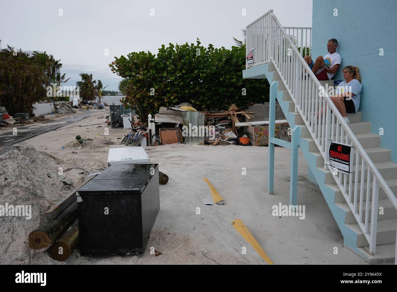 Andy Malloy, top, whose family has owned the home next door for more ...