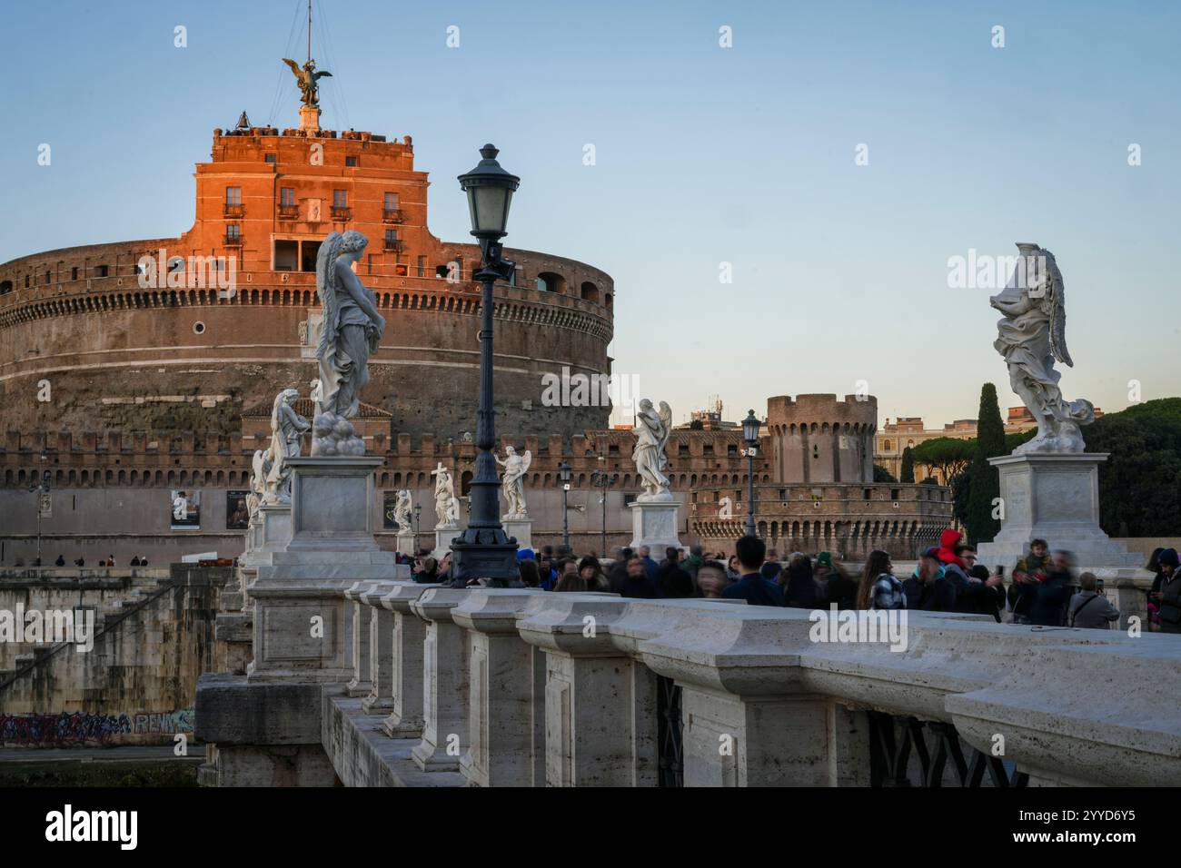 People walk on the St. Angelo's Bridge after its statues where restored as part of the city ...