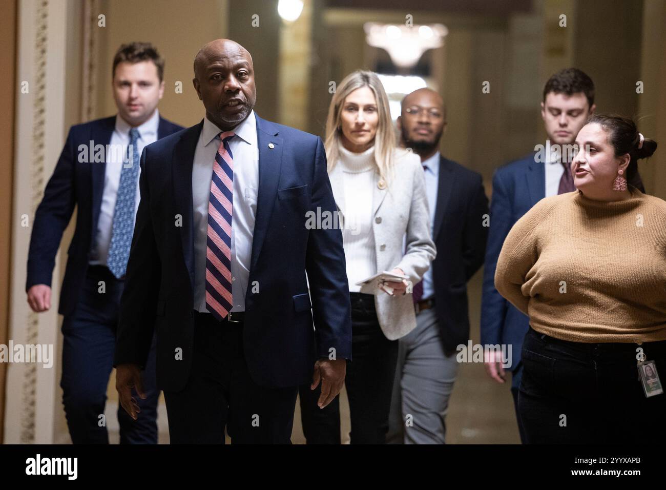 Sen. Tim Scott (R-S.C.) walks with his wife, Mindy Noce, third from ...