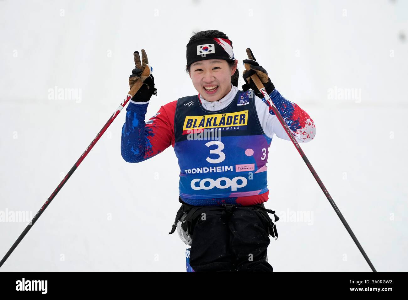 Kim Yunji, of South Korea, celebrates after crossing the finish line to ...
