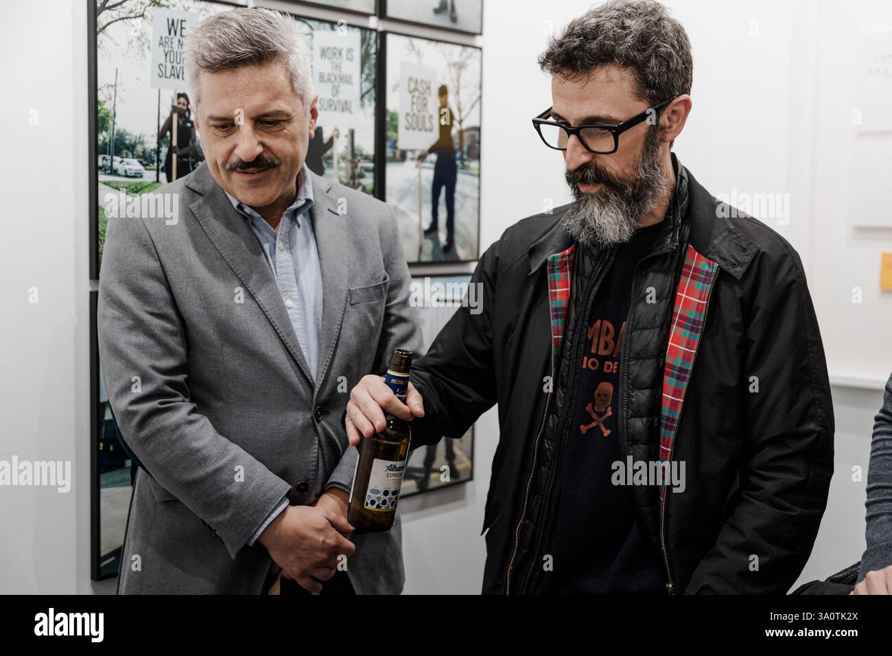 Artist Eugenio Merino (r) at the ARCO Madrid 2025 fair, at IFEMA Madrid ...