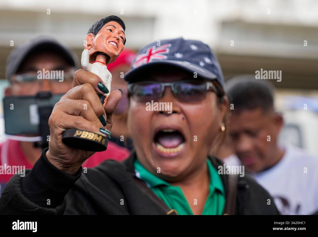 A supporter of former Philippine President Rodrigo Duterte shouts ...