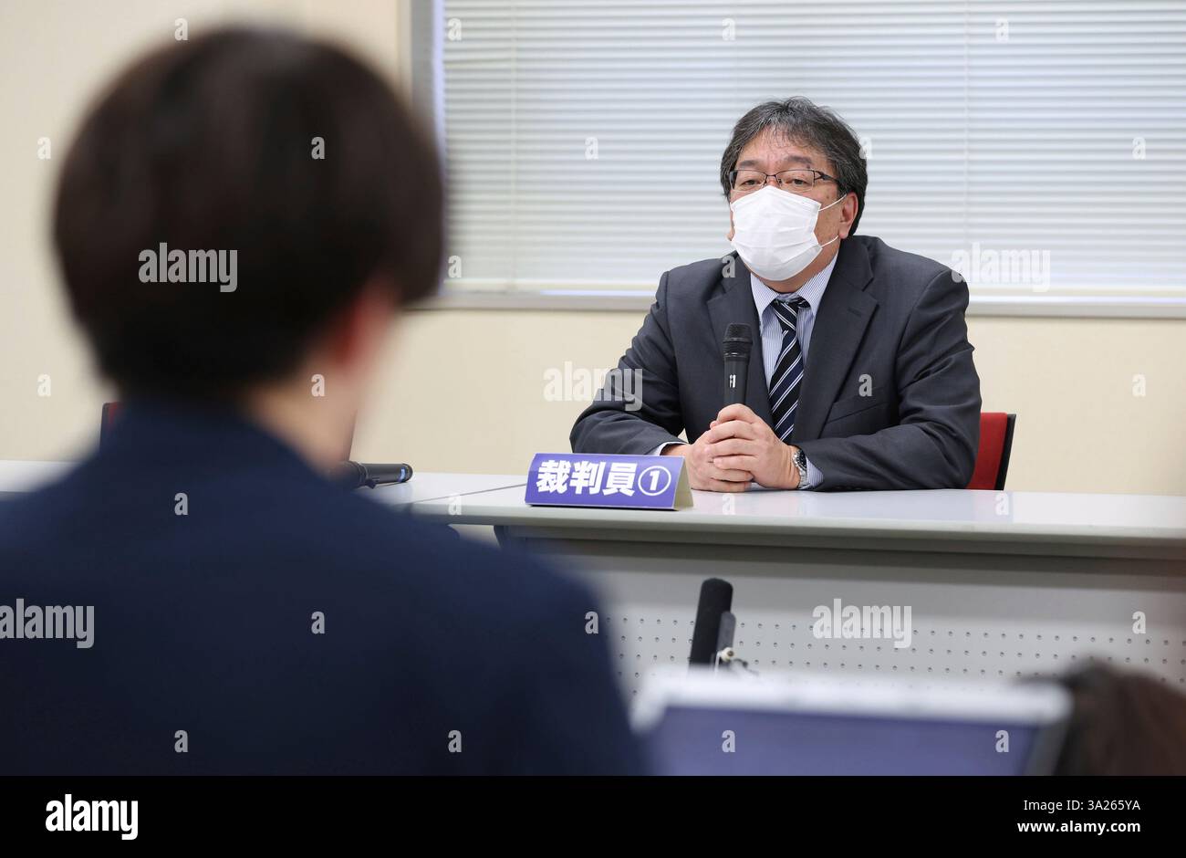 A jury member holds a press conference after a verdict of the lay judge ...