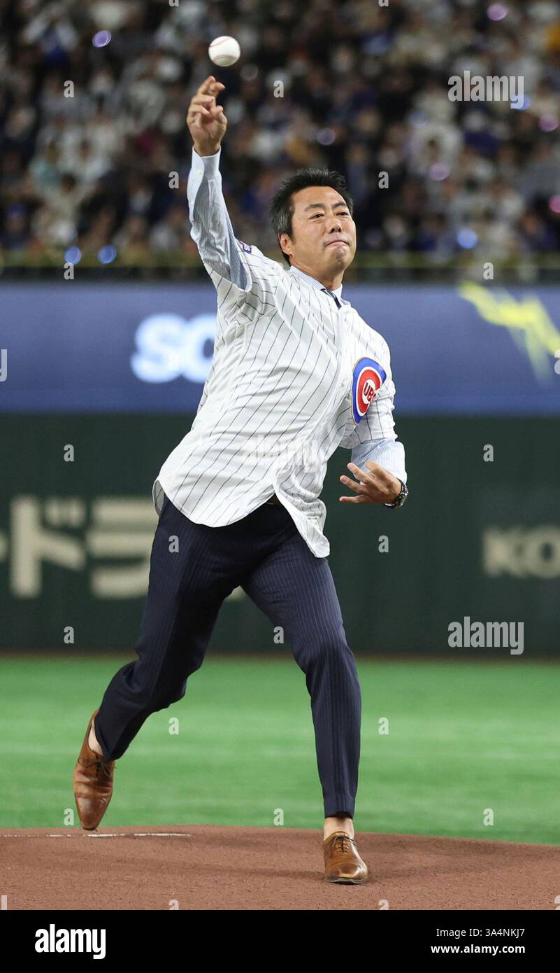 Koji Uehara, Japanese former professional baseball pitcher, throws a ball as a ceremonial first ...