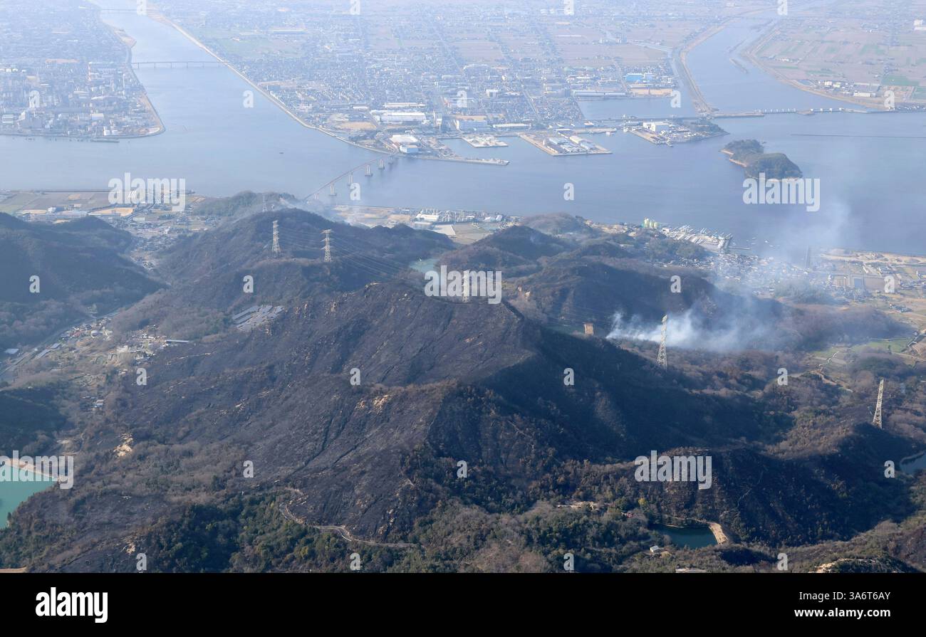 Aerial photo shows burnt mountains due to forest fire in Imabari City ...