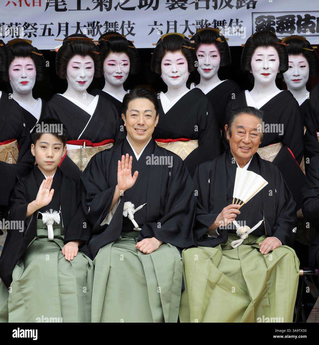 Kabuki actor Onoue Kikunosuke (front row center), his son Onoe ...