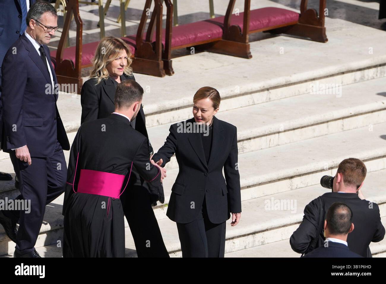 Italy's Prime Minister Giorgia Meloni, center, arrives for the funeral ...