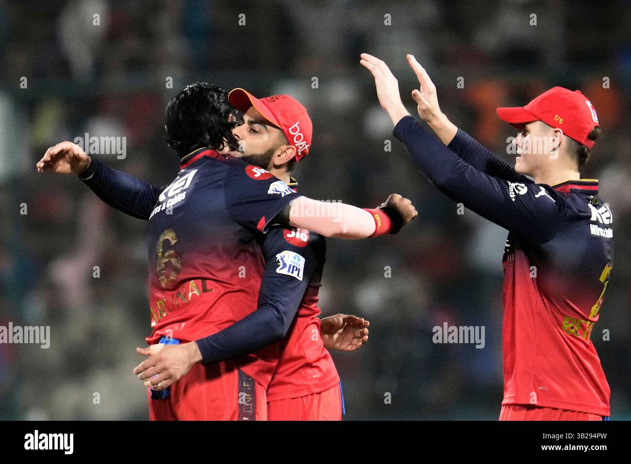 Royal Challengers Bengaluru's Krunal Pandya, left, hugs teammate Virat ...