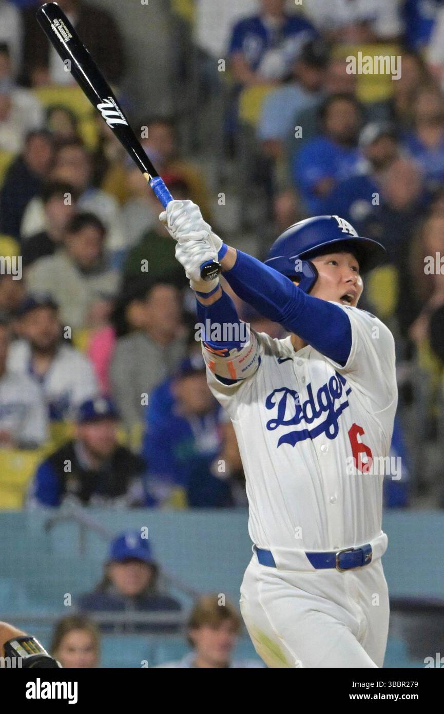 Los Angeles Dodgers Hyeseong Kim watches the flight of the ball on his ...