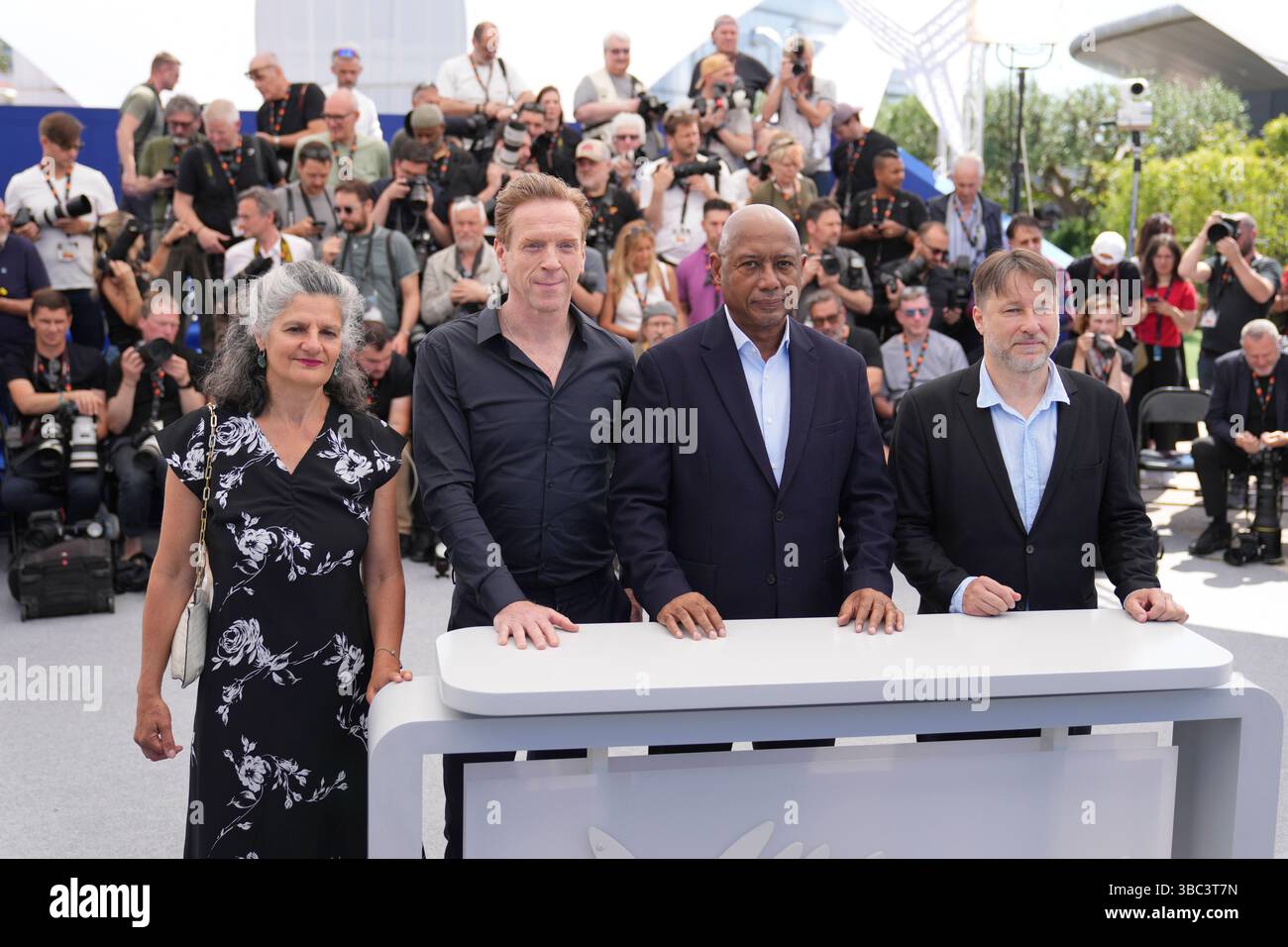 Editor Alexandra Strauss, from left, Damian Lewis, director Raoul Peck ...