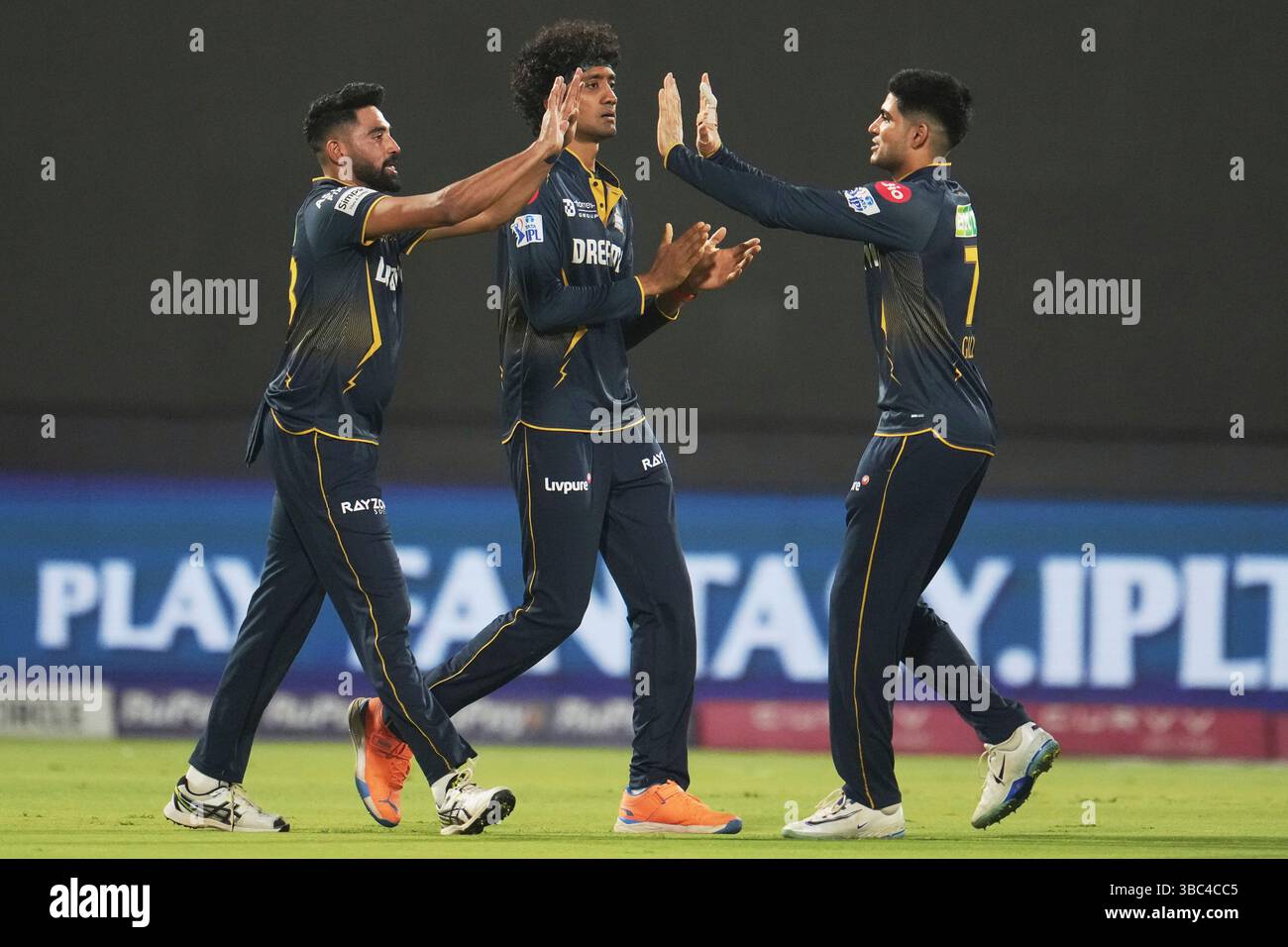 Gujarat Titans' Mohammed Siraj, left, celebrates with captain Shubman ...