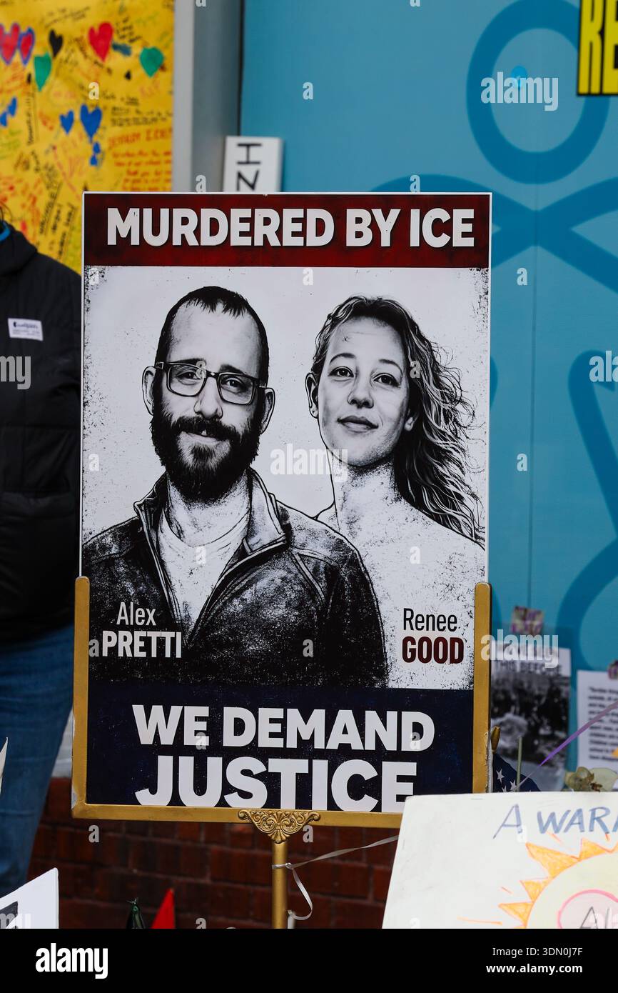 Vertical image of a sign displaying portraits of Alex Pretti and Renee ...