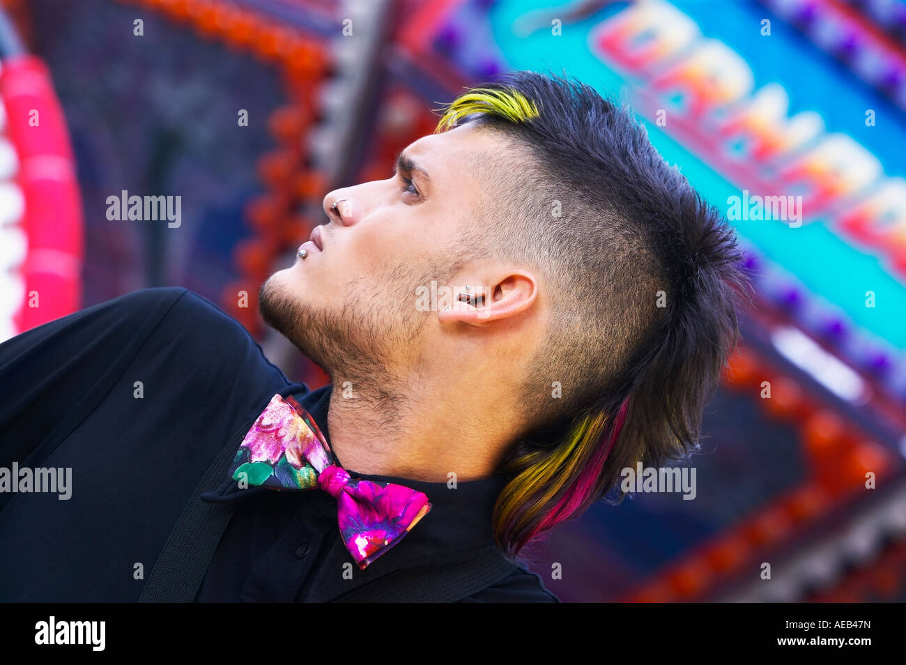 Low angle view of young Hispanic male punk avec mohawk et bowtie Photo ...