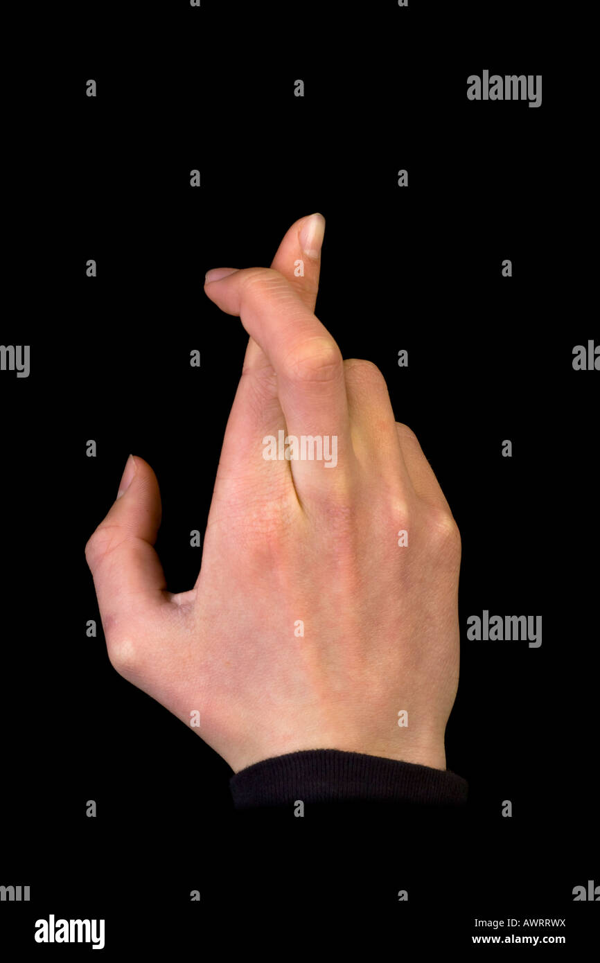 La main droite les doigts croisés pour la bonne chance Photo Stock - Alamy