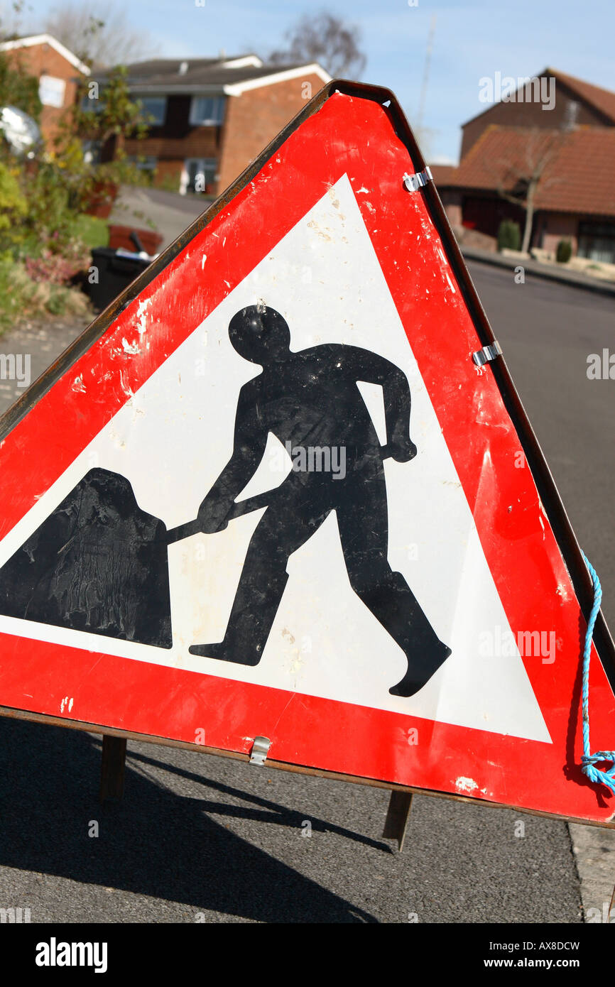 Man digging road work sign Banque de photographies et d’images à haute ...