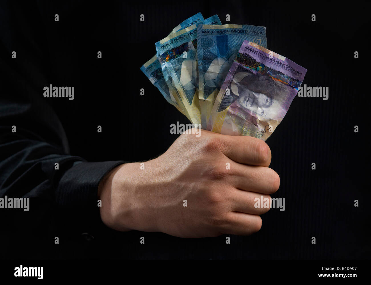 Hand full of money Banque de photographies et d’images à haute ...