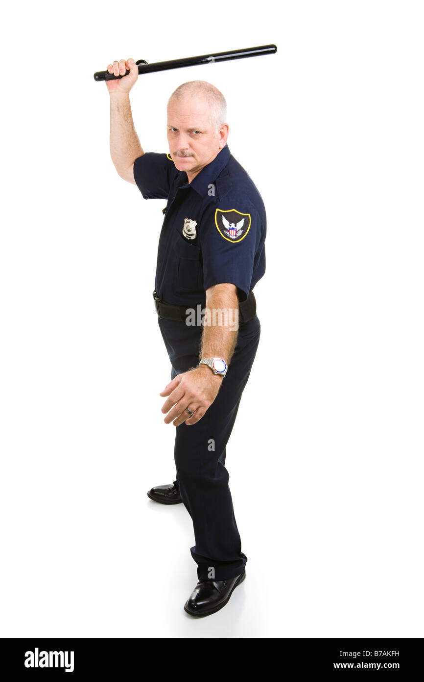 Officier de police dans une posture agressive à l'aide de son bâton de ...
