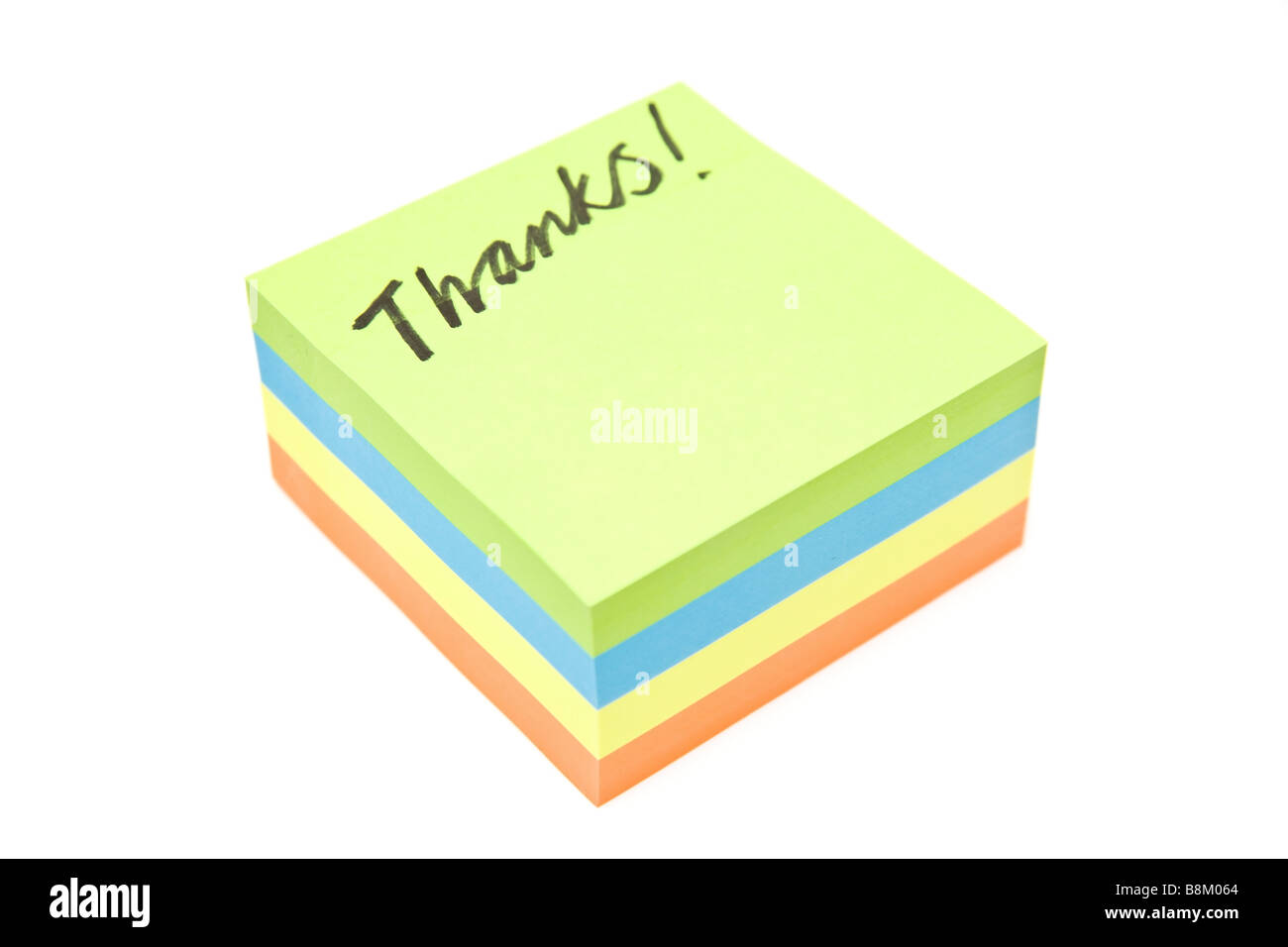 Merci écrit sur un post it isolated on a white background studio Photo ...