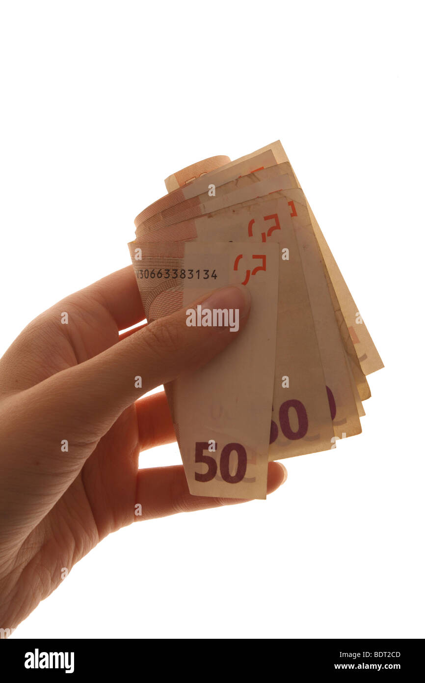 Hand holding wad euro banknotes Banque de photographies et d’images à ...