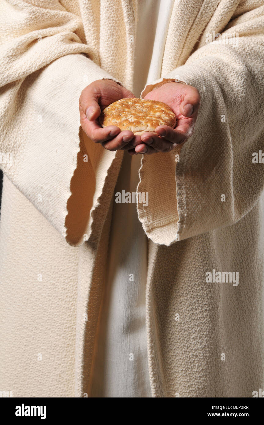 Jésus tenant un pain comme un symbole de pain de vie Photo Stock - Alamy