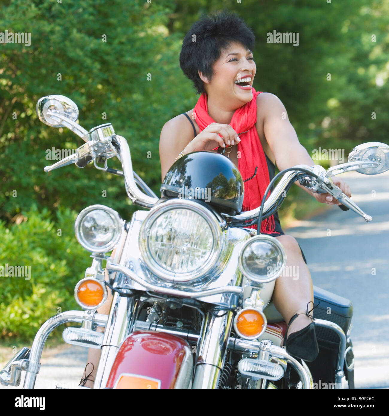 Mature woman riding motorcycle Banque de photographies et d’images à ...