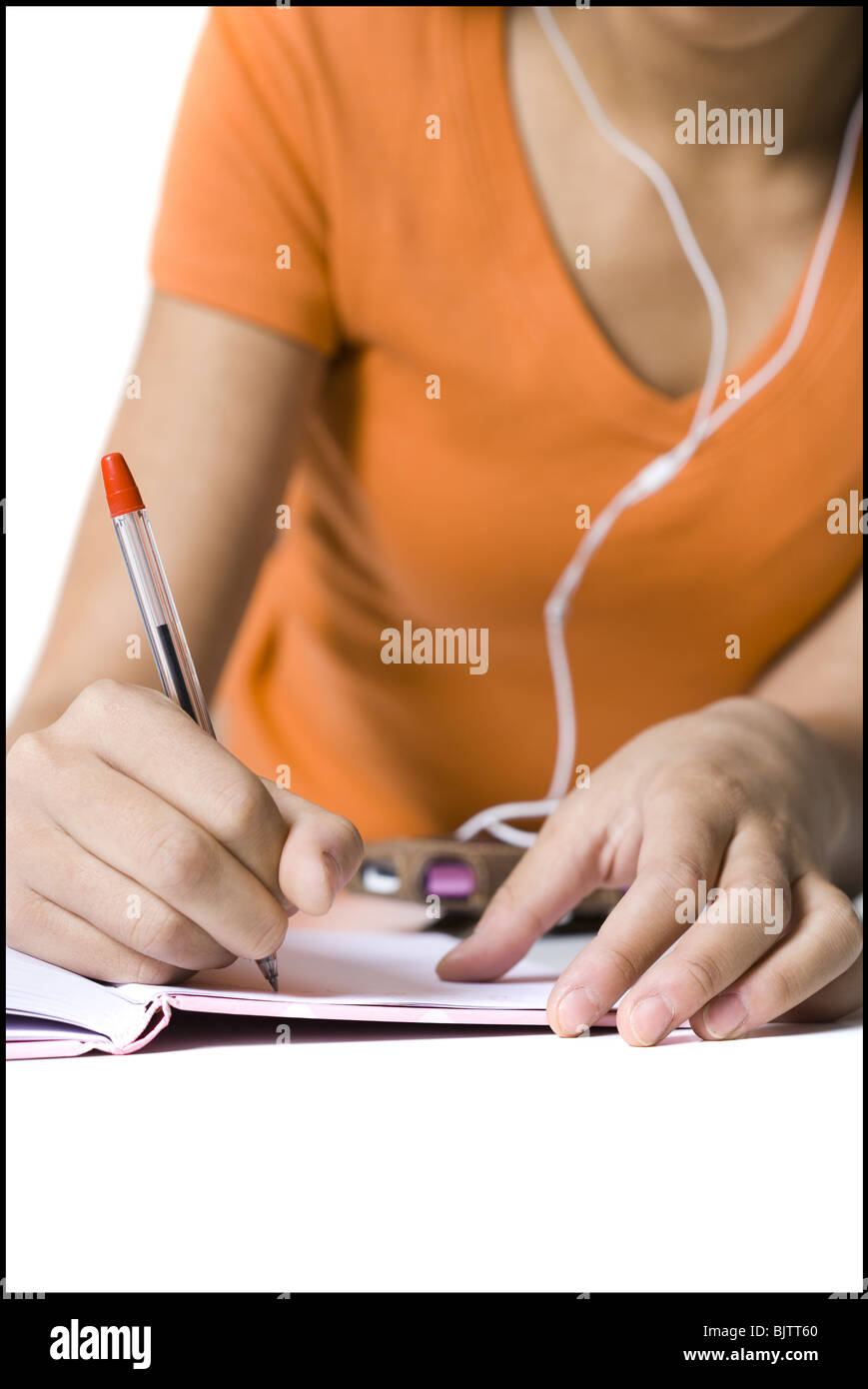 Teenage girl writing in notebook Photo Stock - Alamy