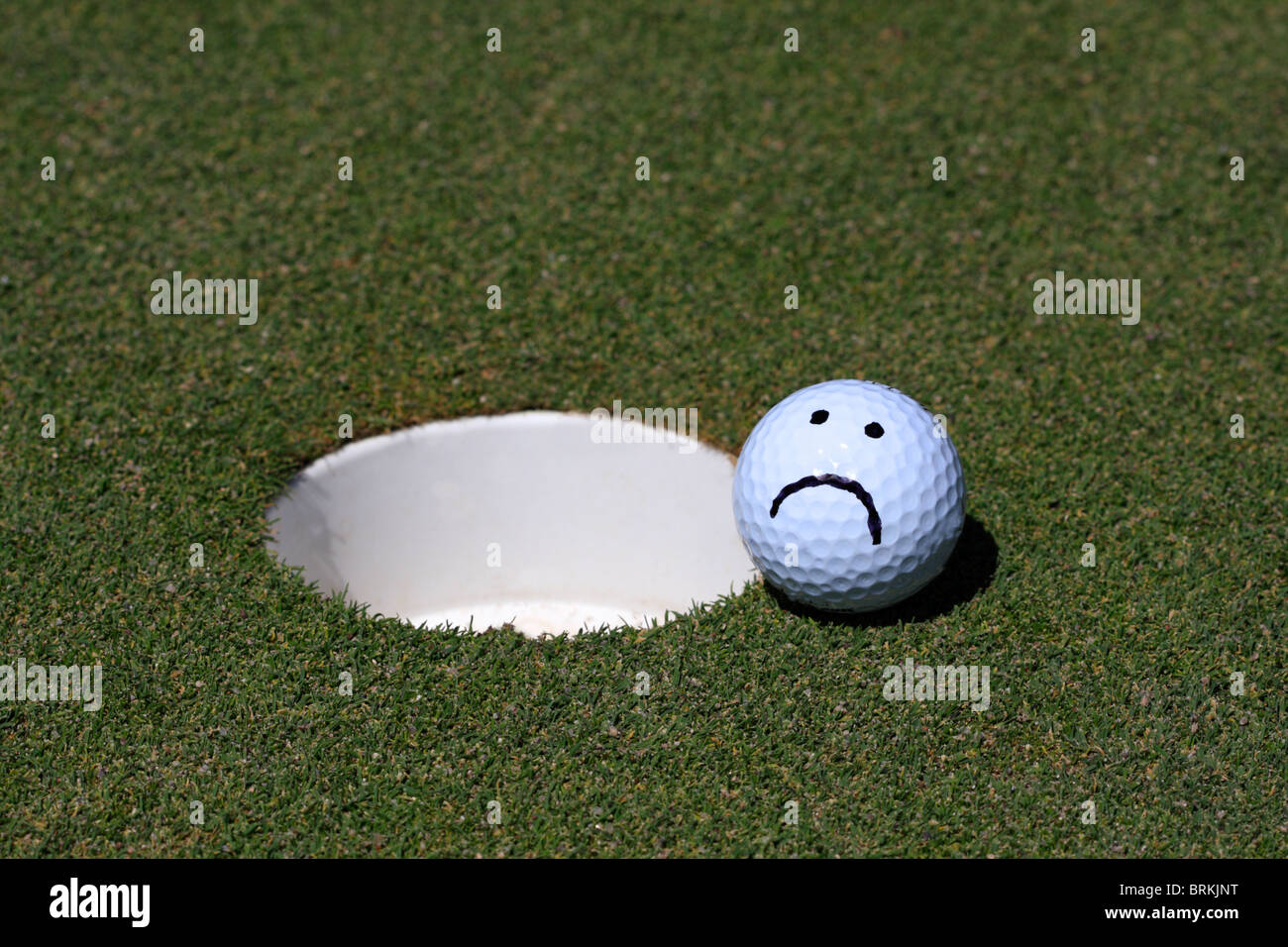 Sad face golf ball Banque de photographies et d’images à haute ...