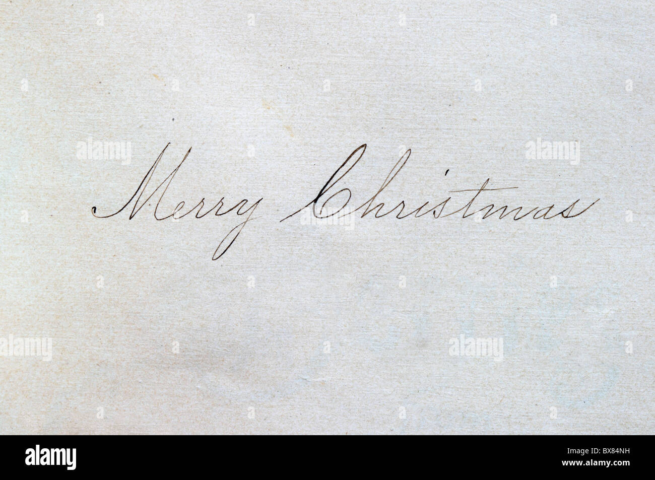 Joyeux Noël écrit en écriture cursive sur papier avec un stylo d'encre ...