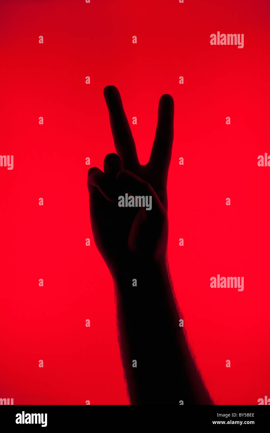 La silhouette d'une part, faire un signe de la paix Photo Stock - Alamy