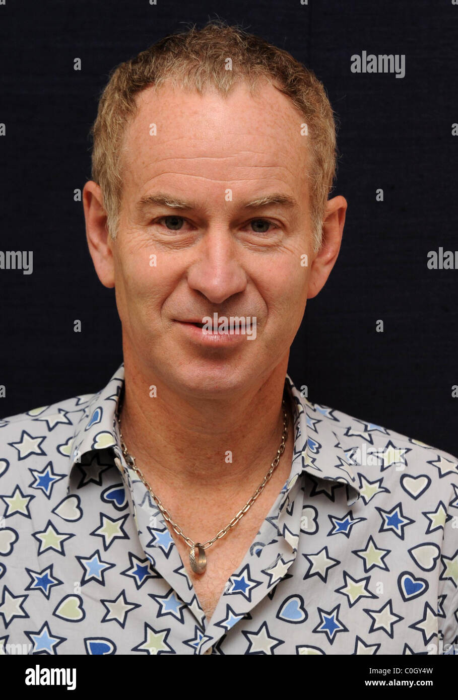 John McEnroe assiste à un photocall avec Andy Warhol's 'Portrait de ...