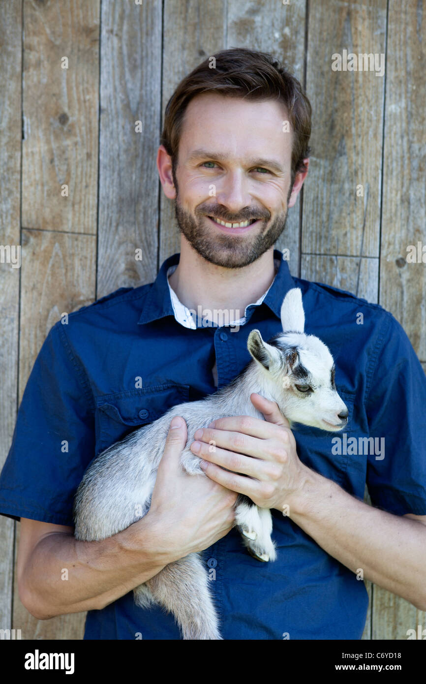 Man with goat Banque de photographies et d’images à haute résolution ...